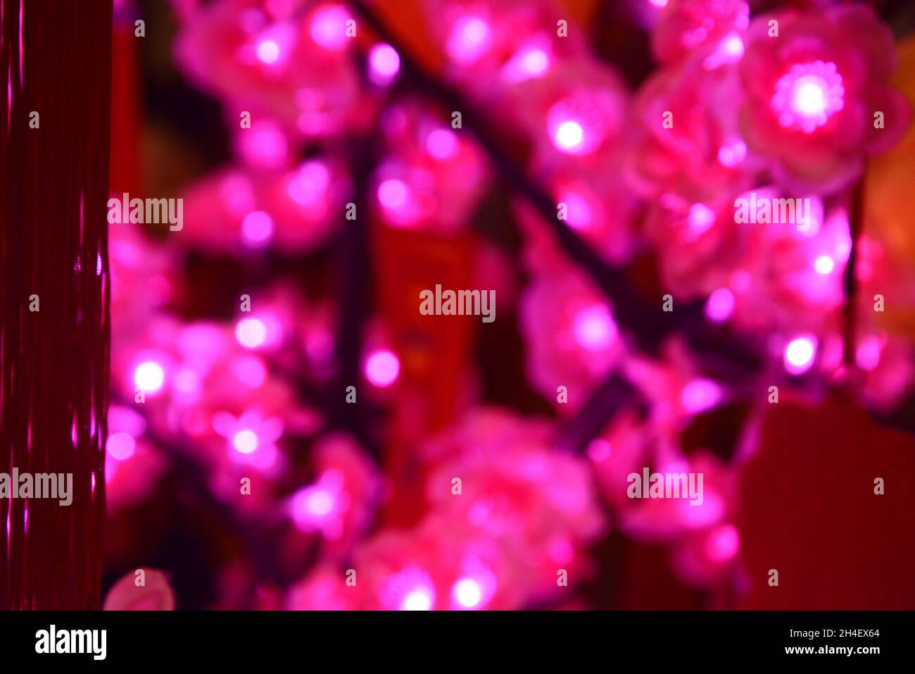 pink and maroon glittering blur glowing background Stock Photo - Alamy