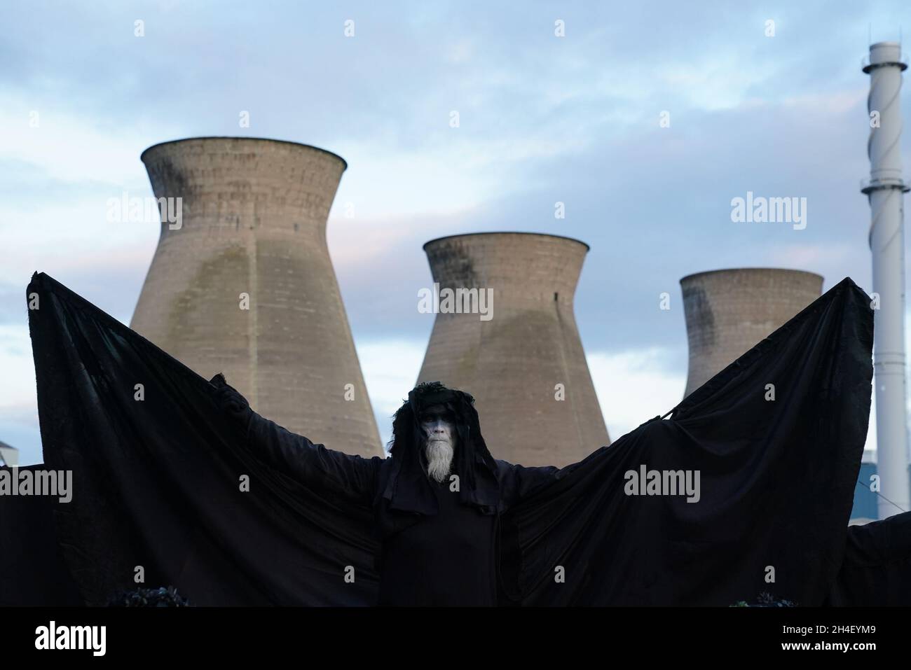 A climate activists from Ocean Rebellion, representing an 'oil slick ...