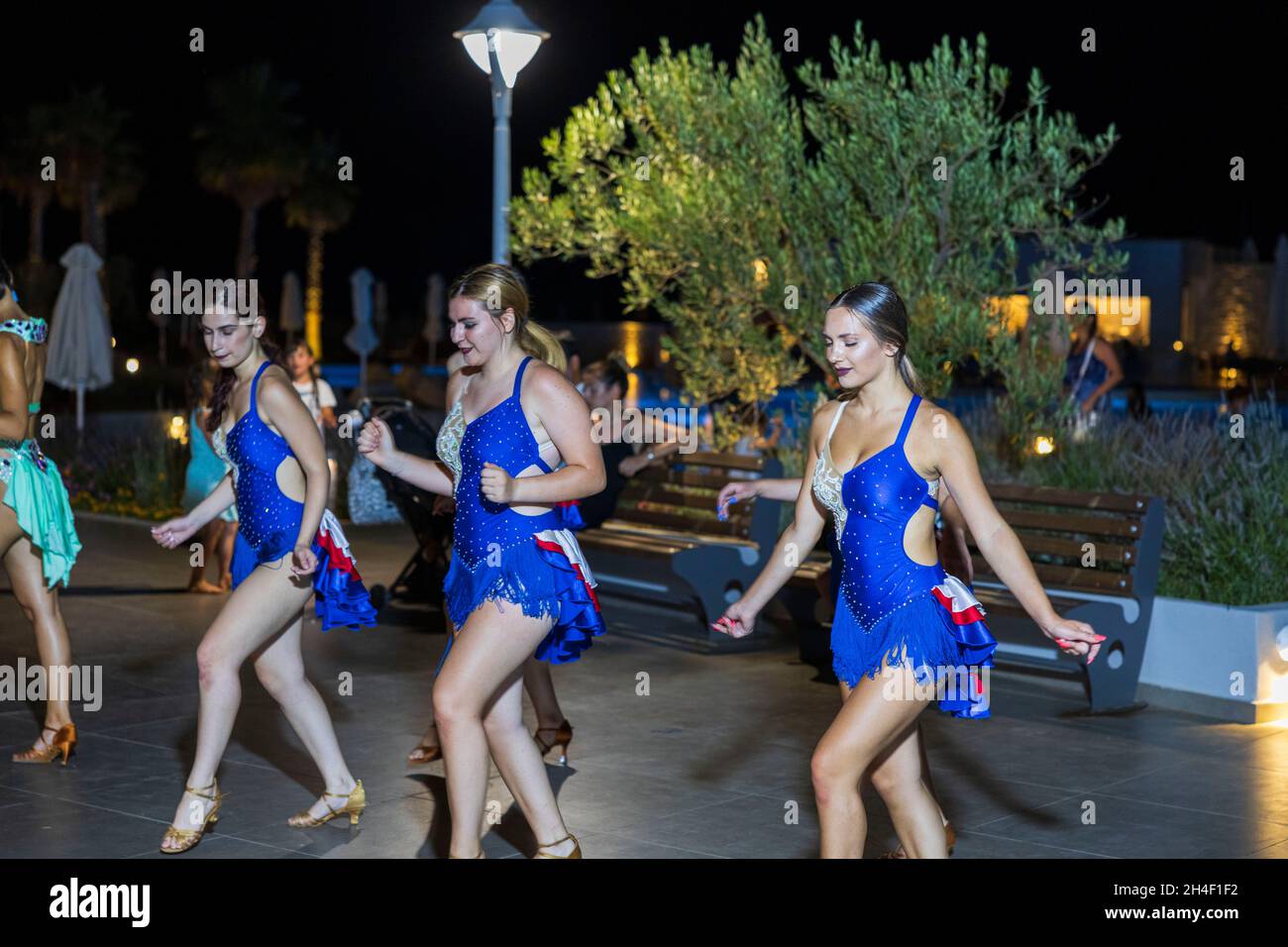 Showing beautiful dancers performing in front of tourists with ...