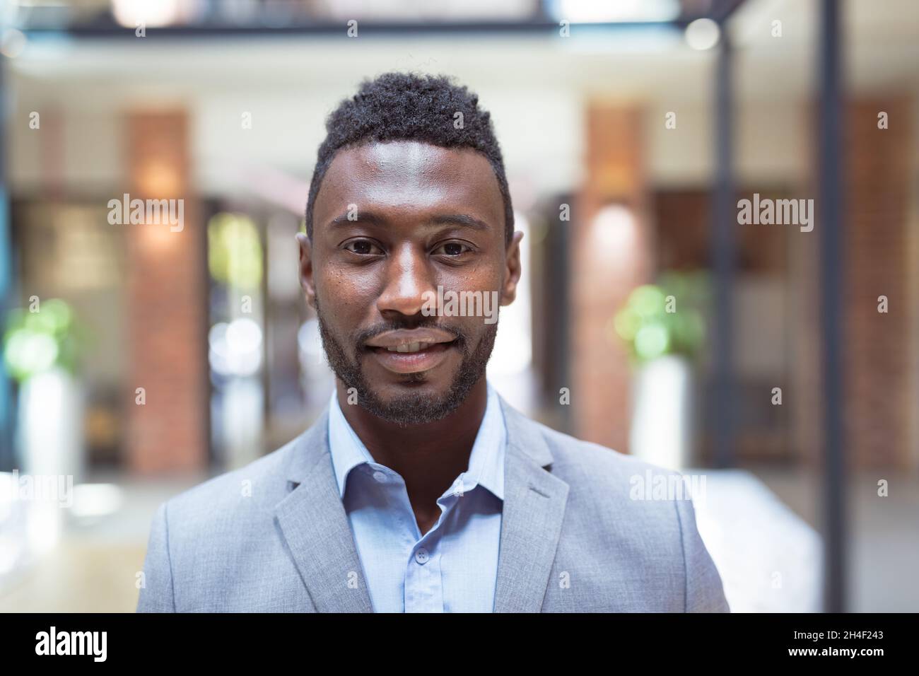 African businesswoman laptop smiling camera hi-res stock photography ...