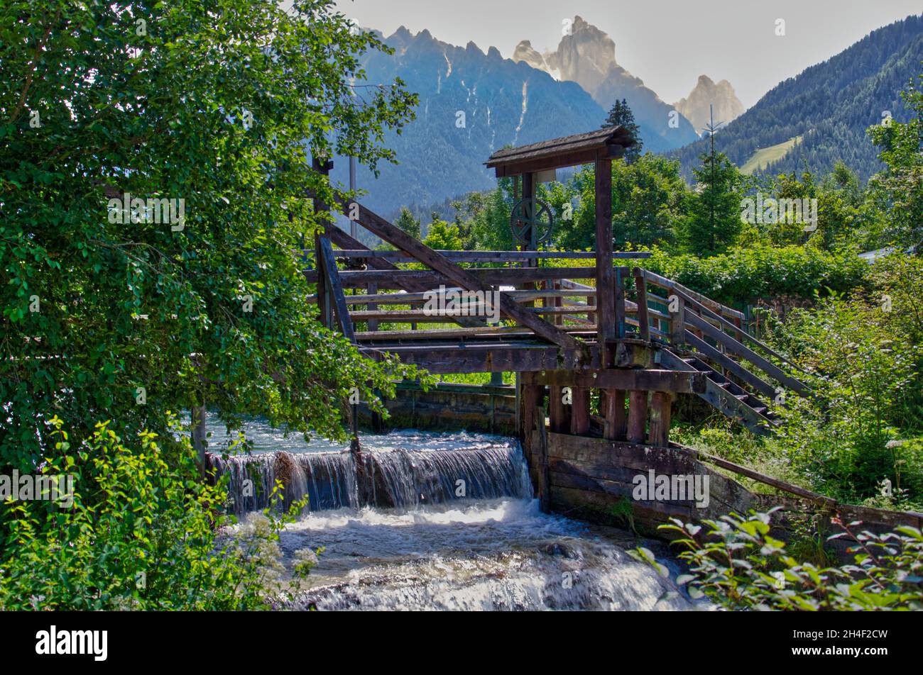 Small wooden bridge over the Rienza river near the village of ...