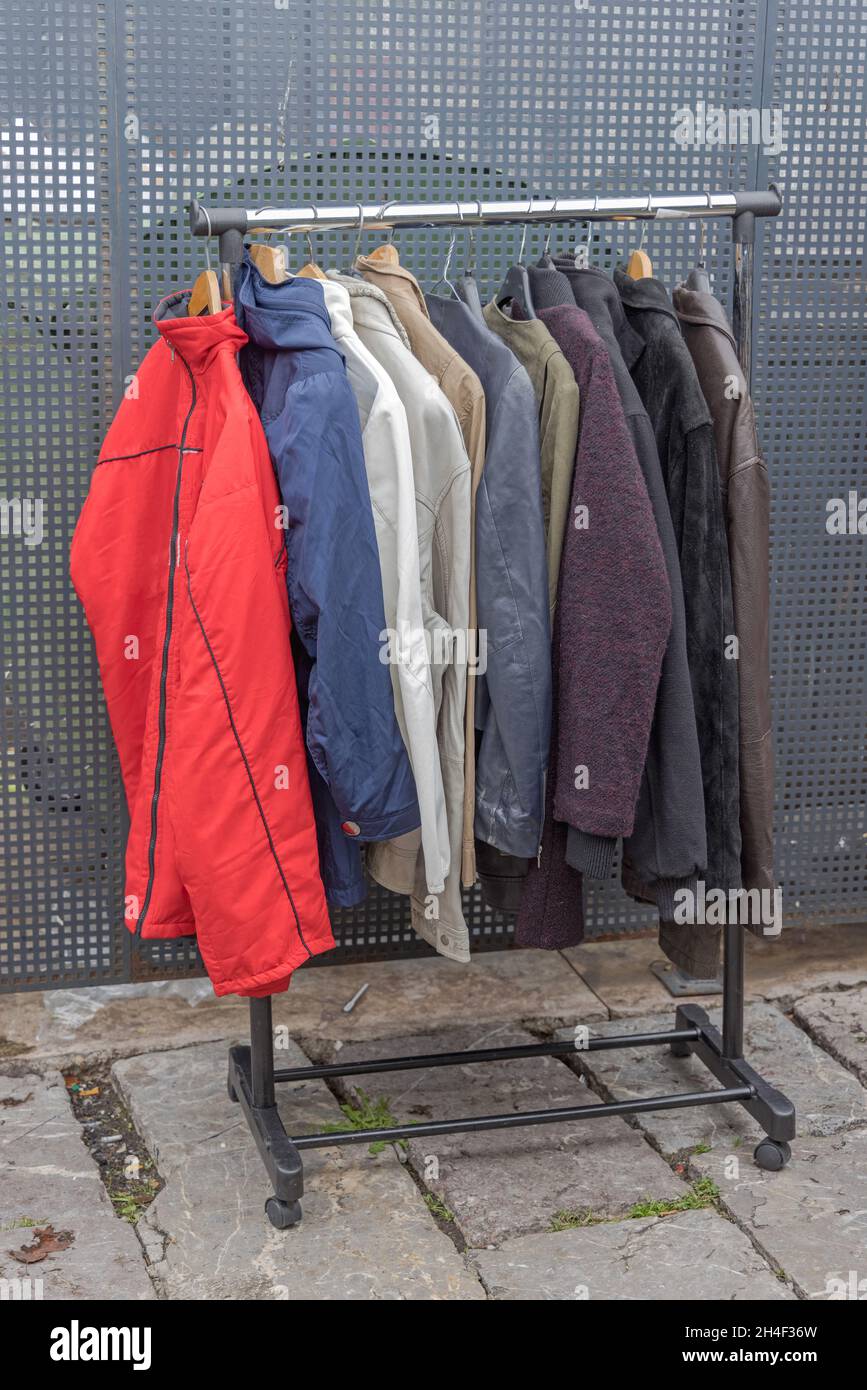 Coats and Jackets at Hangers Outdoor Flea Market Stock Photo - Alamy
