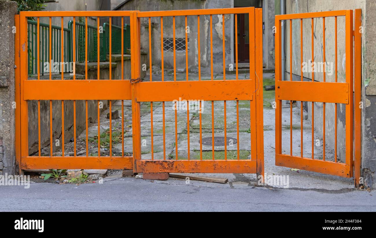 Orange Metal Bars Gate Entrance to Car Parking Place Stock Photo - Alamy