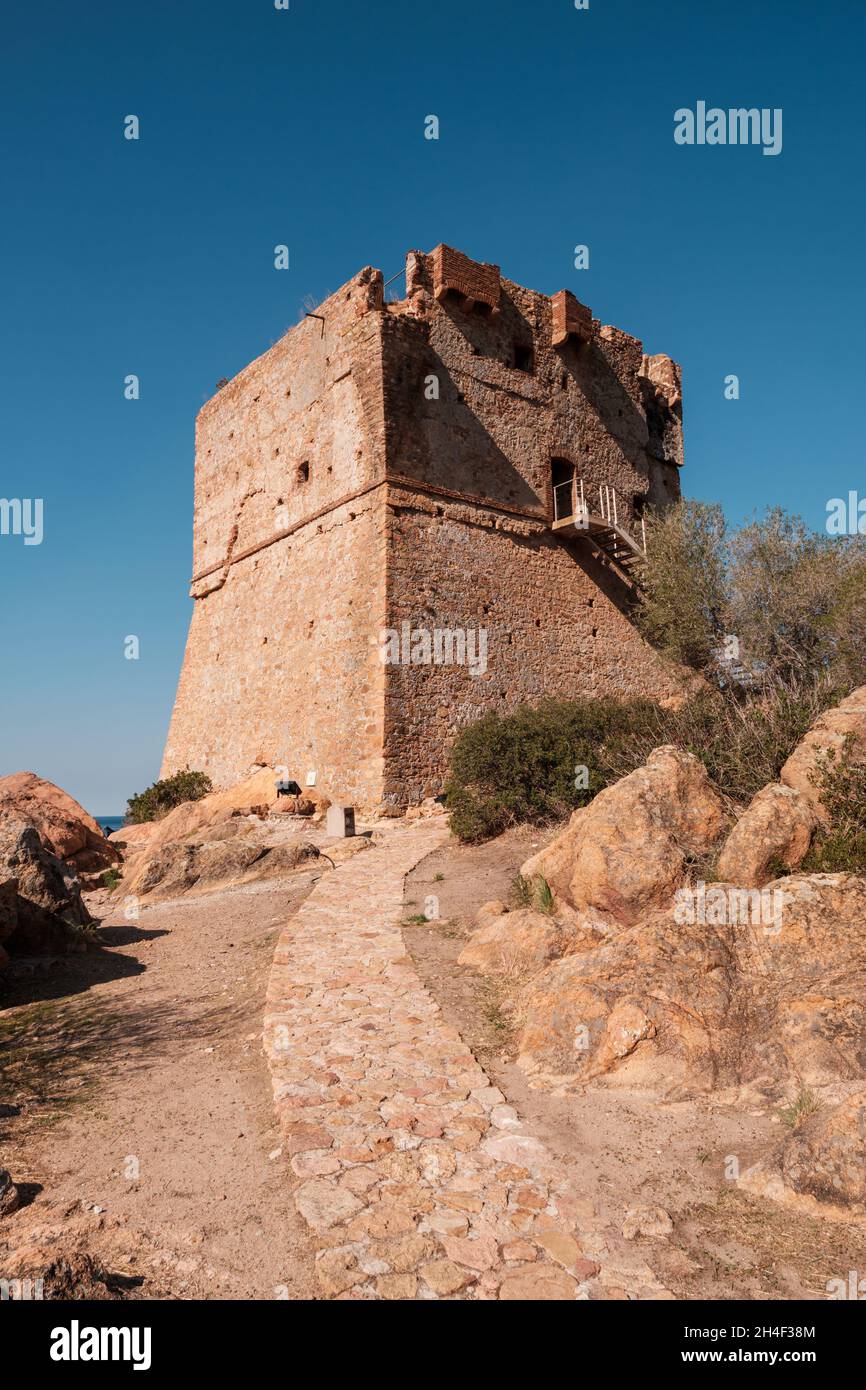 The ancient Genoese tower amongst the rocks at Porto on the west coast ...