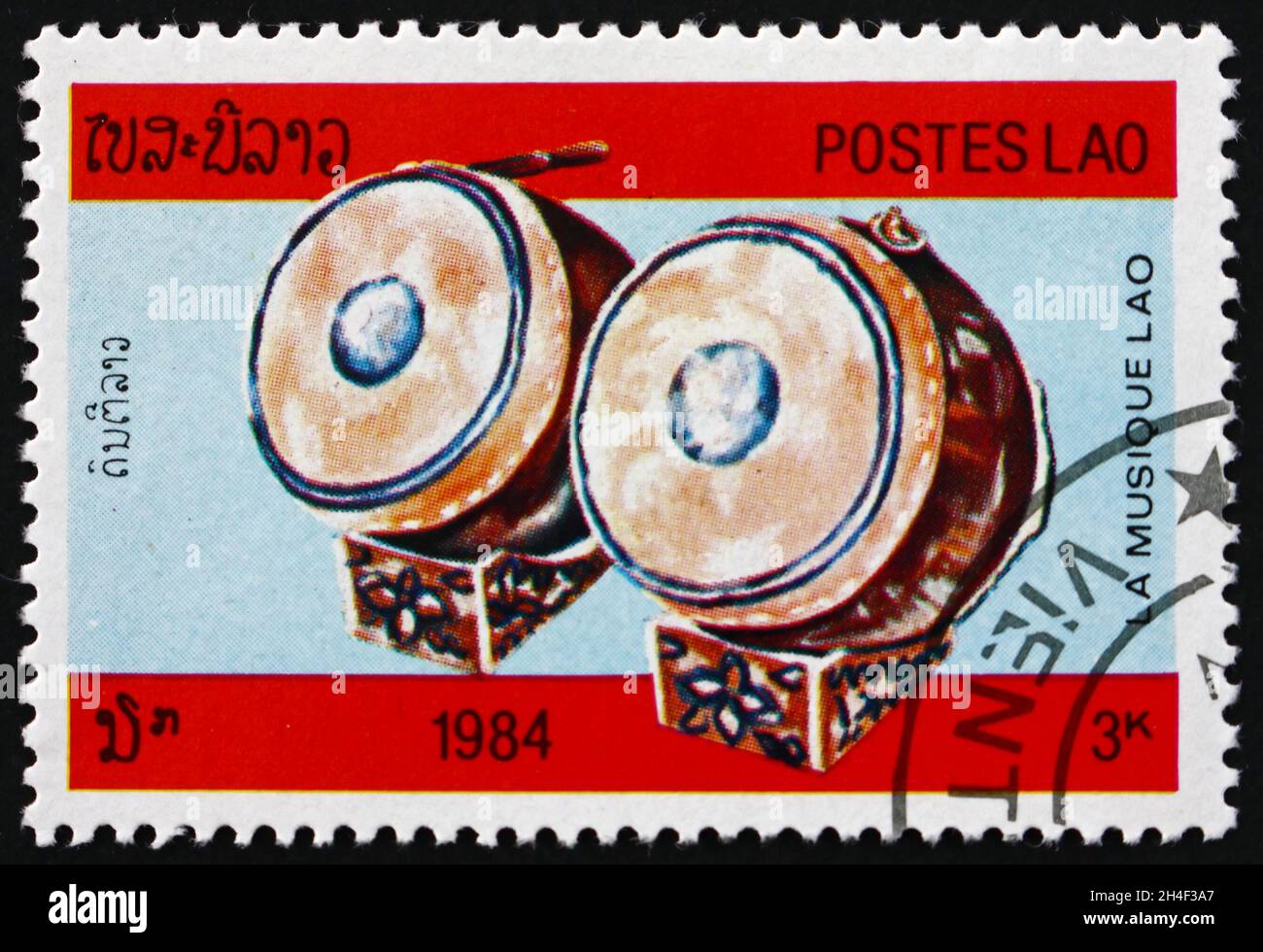 LAOS - CIRCA 1984: a stamp printed in Laos shows pair of drums, musical ...