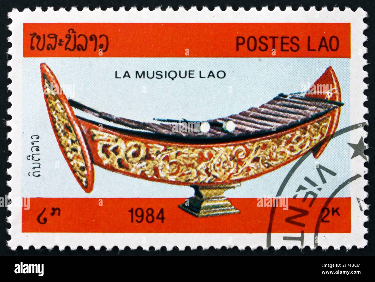 LAOS - CIRCA 1984: a stamp printed in Laos shows xylophone, musical ...