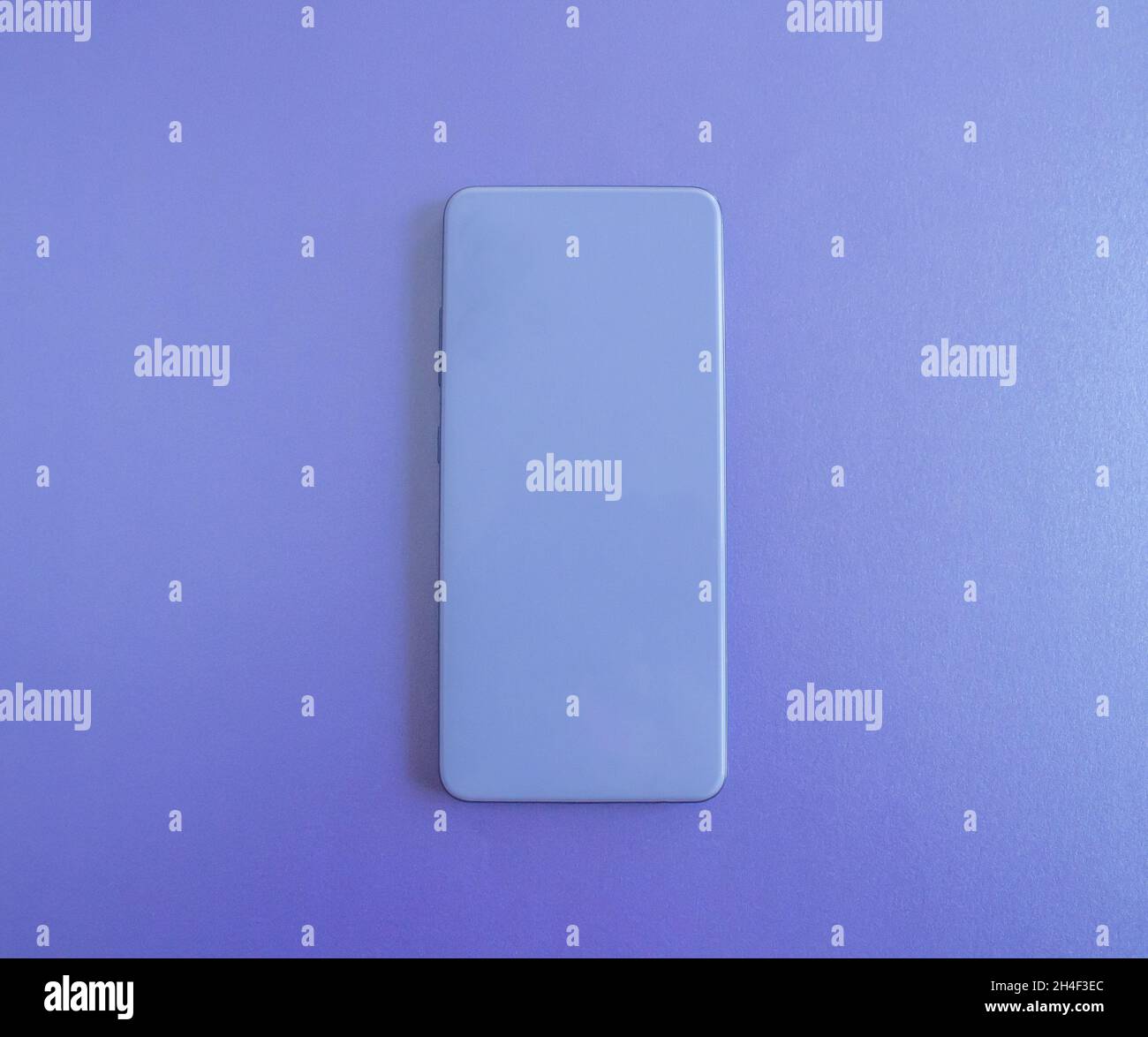 Purple smartphone, top view of cellphone isolated on purple background ...