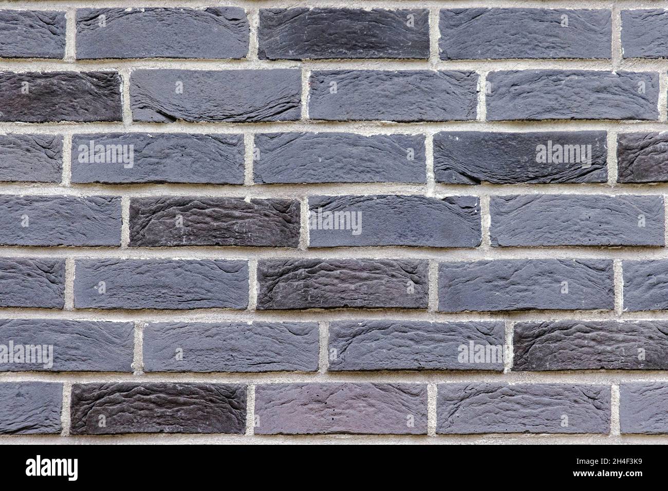 Grey and Black Bricks Building Wall Exterior Background Stock Photo - Alamy