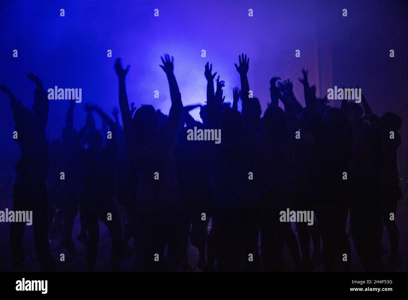 Group of people dancing with their hands up during the party Stock ...