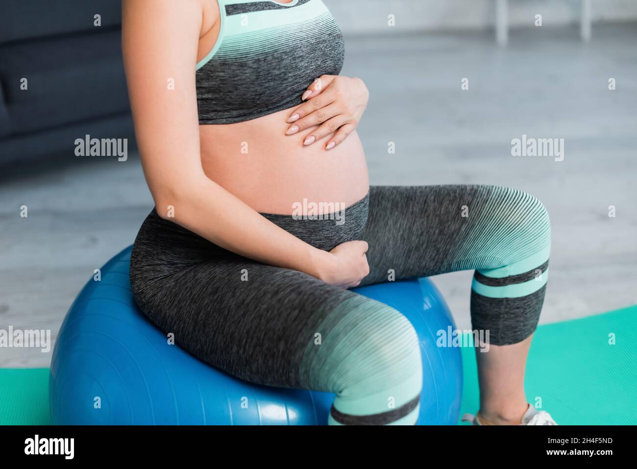 Woman hugging exercise ball hi-res stock photography and images - Alamy