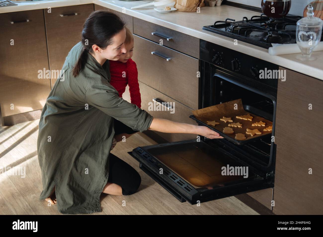 Close up woman puts gingerbread hi-res stock photography and images - Alamy