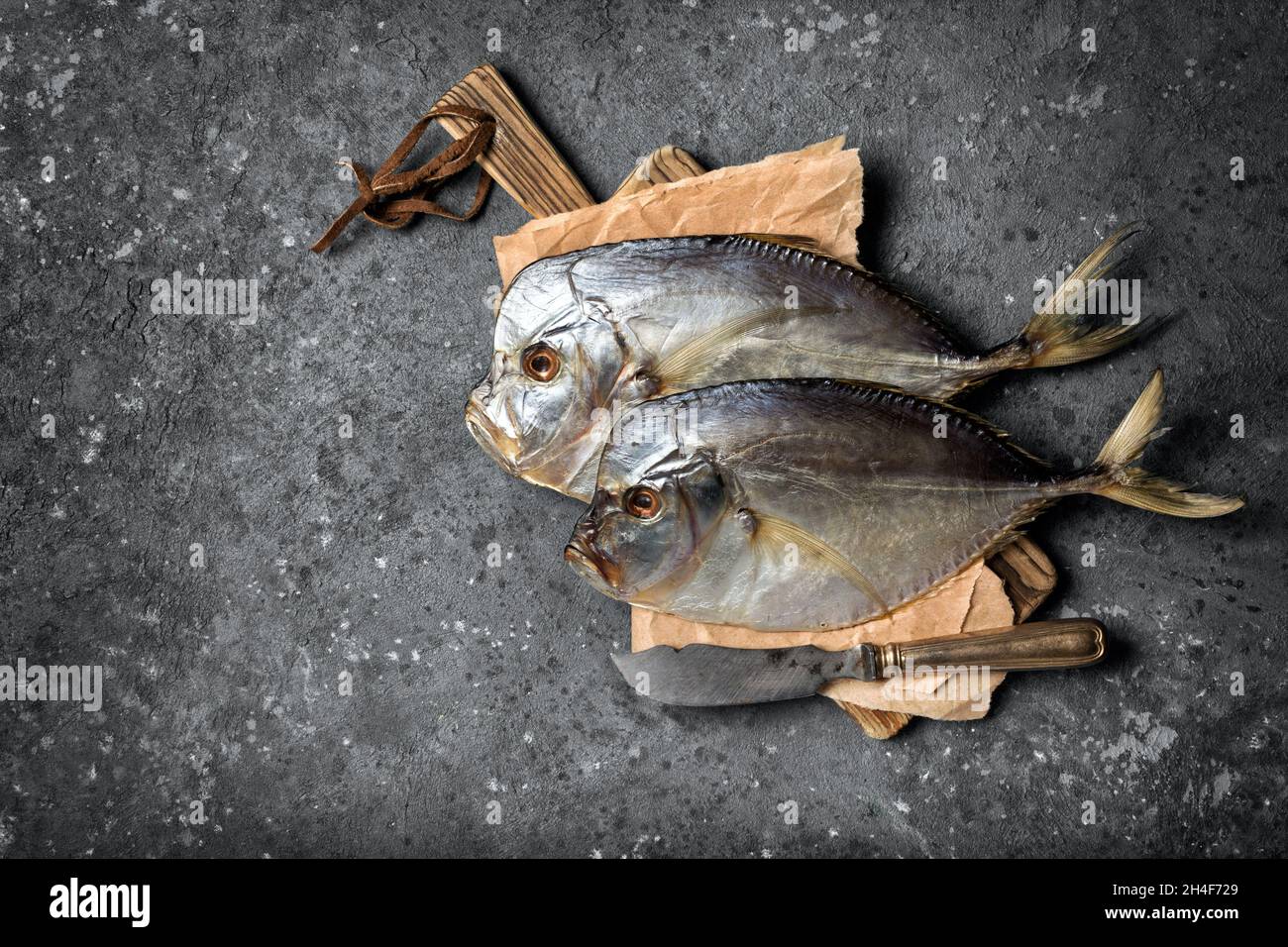 Top view of tasty salty dried sea fish vomer or Selena with silver ...