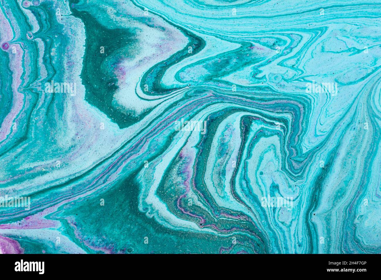 Closeup of mixed turquoise and purple abstract marble texture. Hand ...