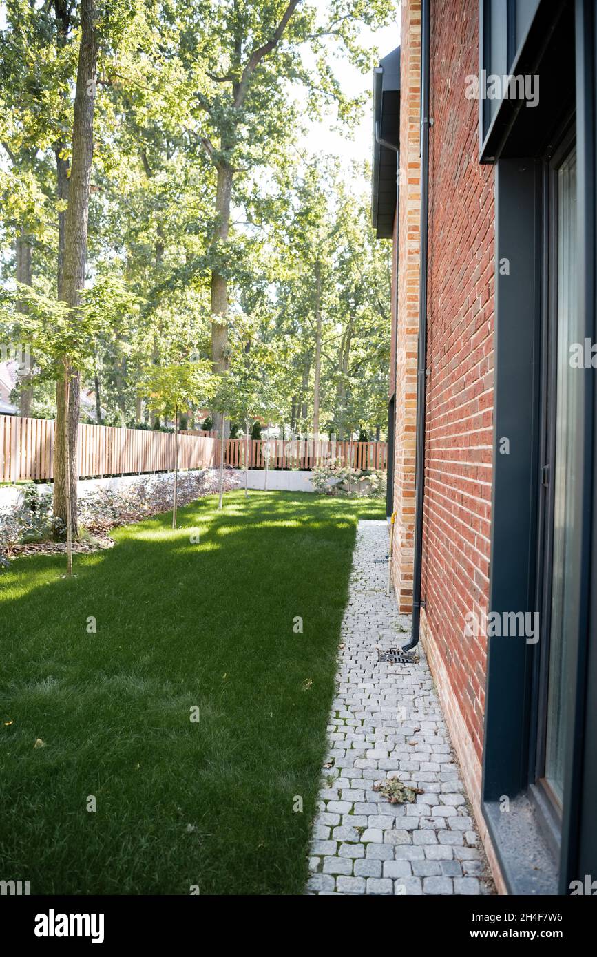 sunshine on backyard with green lawn near modern house Stock Photo - Alamy
