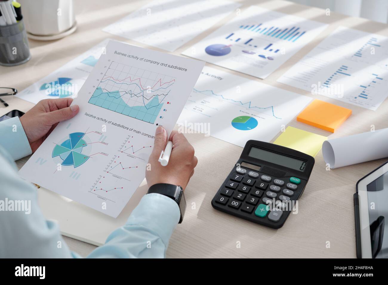 Business analyst examining charts hi-res stock photography and images ...