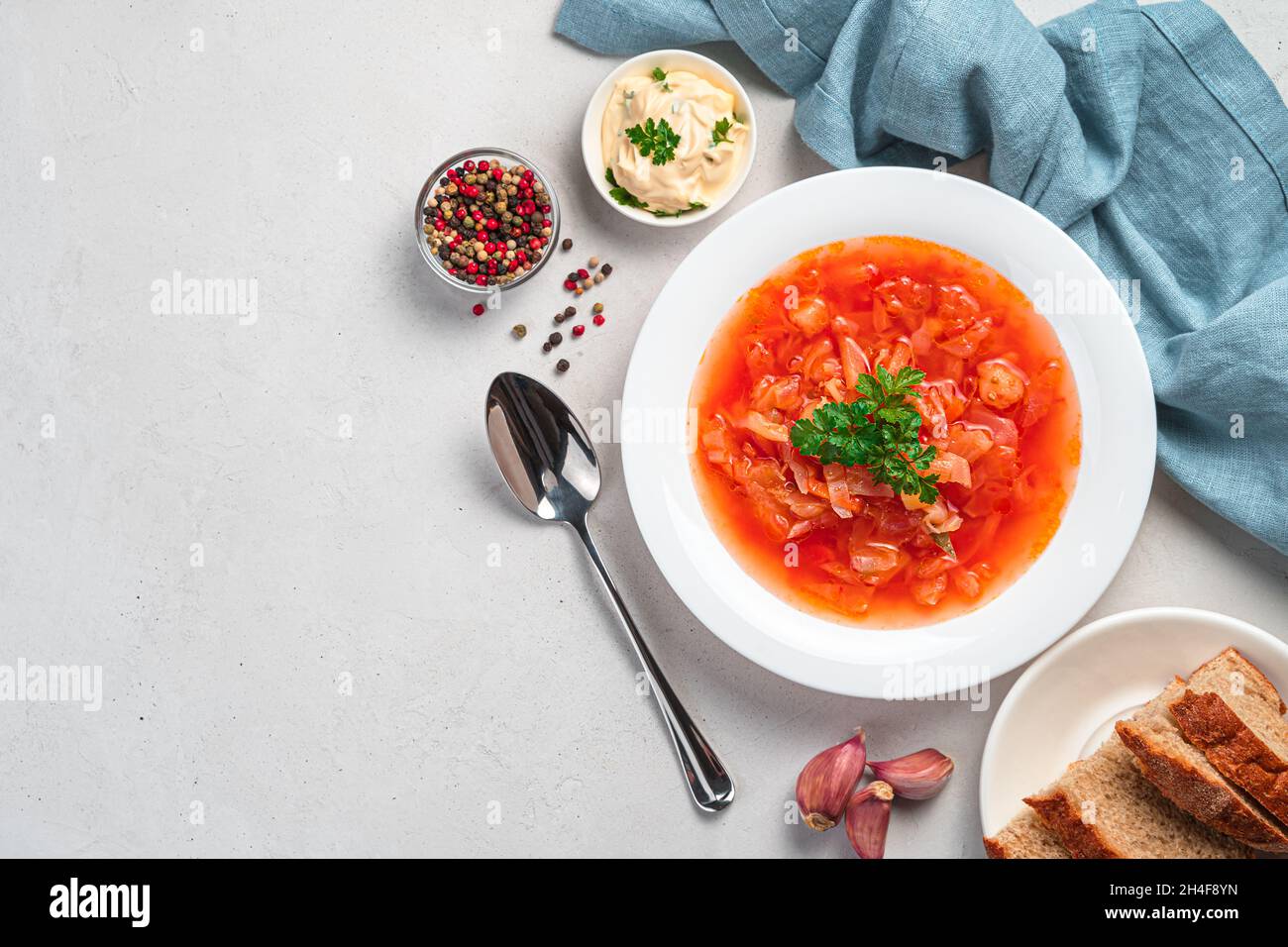 A portion of traditional borscht with fresh parsley. Top view, copy ...