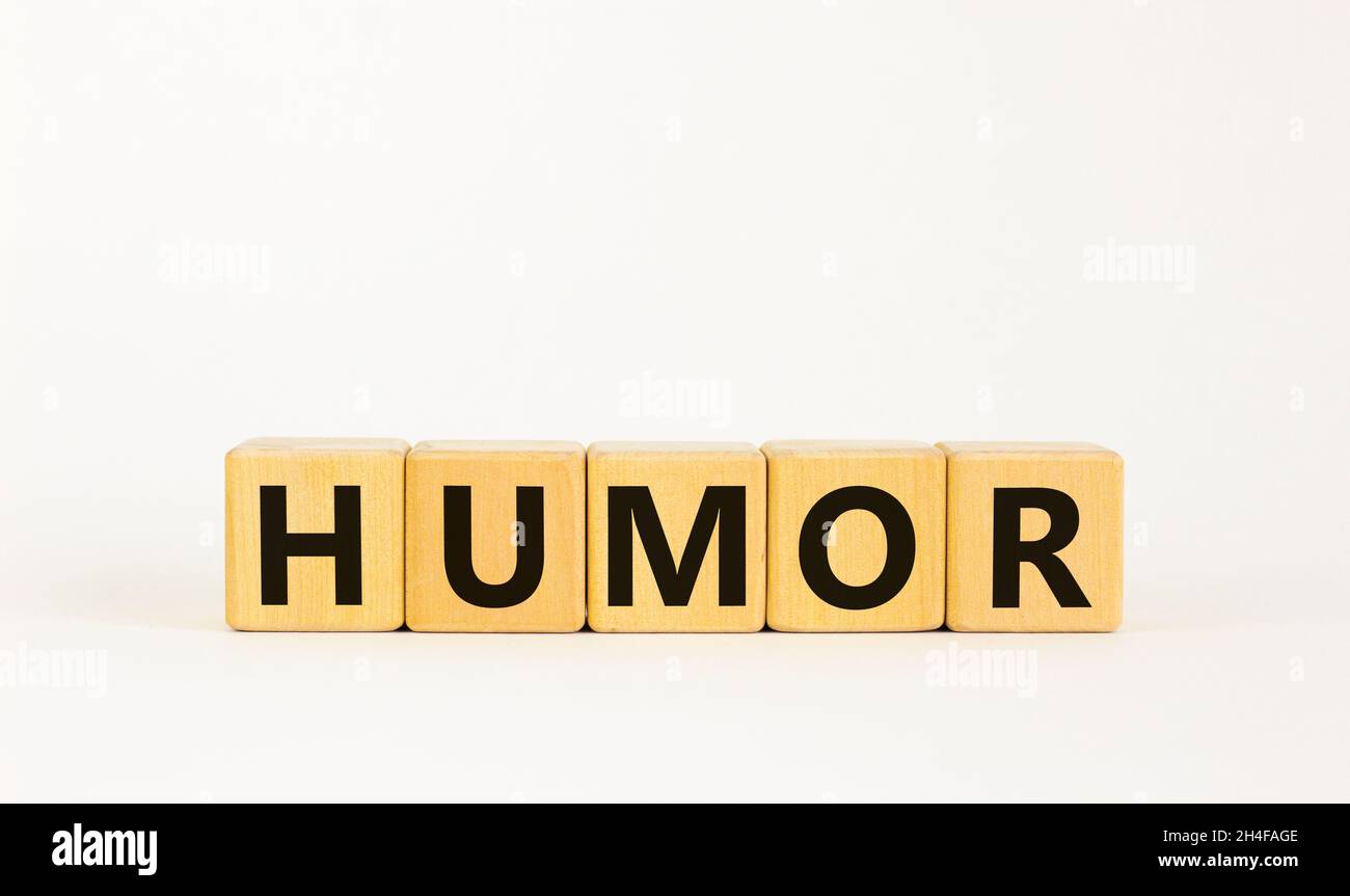 Humor symbol. The concept word 'humor' on wooden cubes. Beautiful white ...