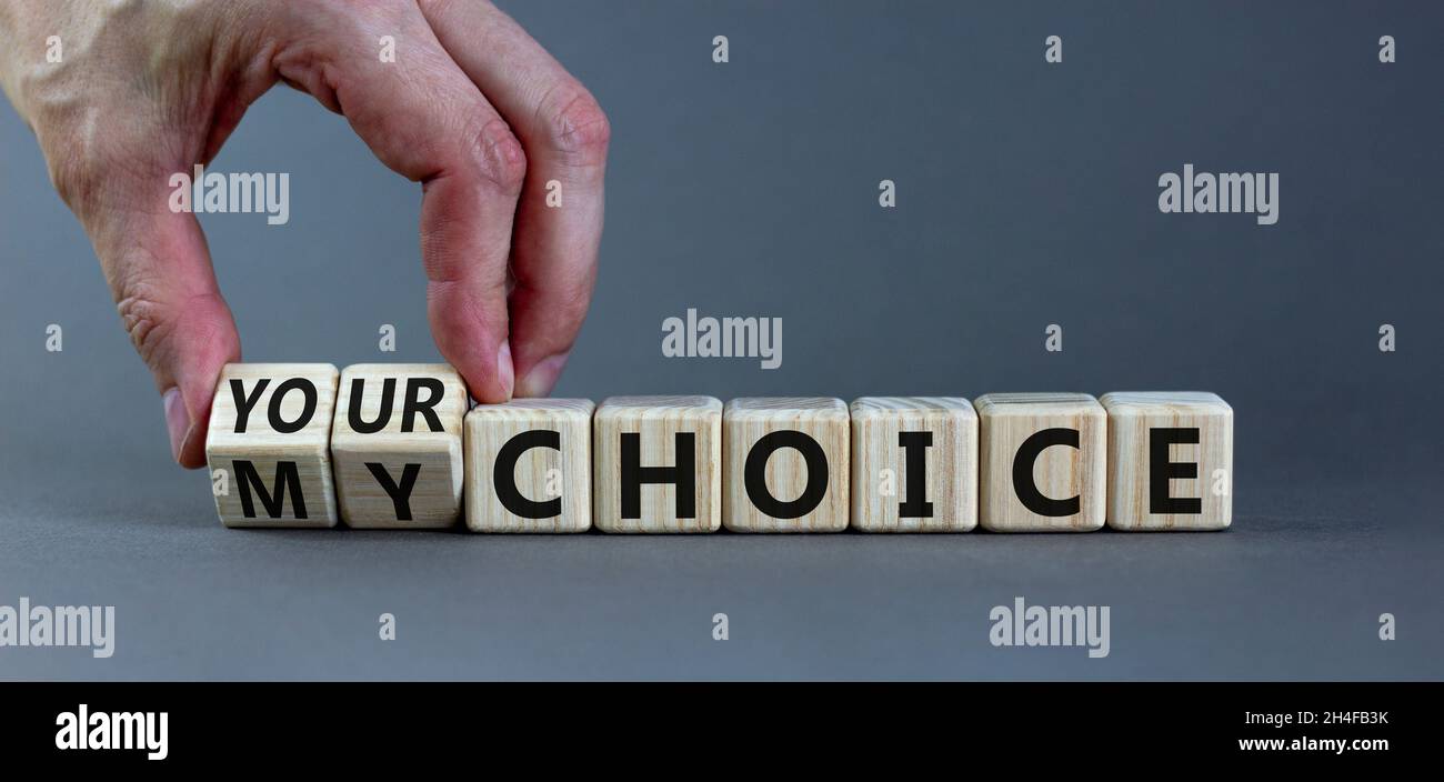 My or your choice symbol. Businessman turns wooden cubes and changes ...