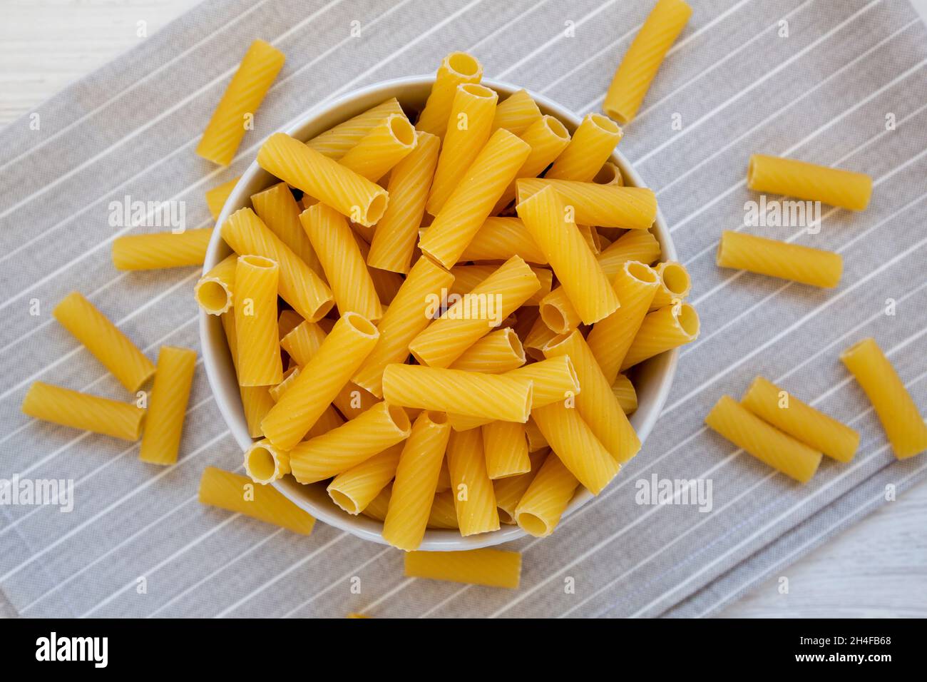 Dry Rigatoni Pasta in a gray Bowl, top view. Flat lay, overhead, from ...