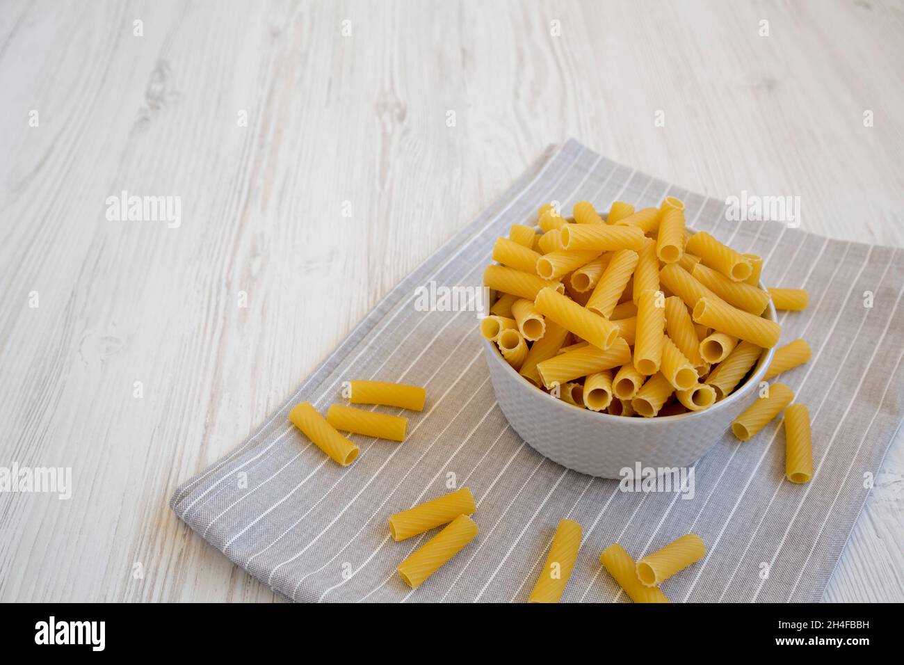 Dry Rigatoni Pasta in a gray Bowl, side view. Copy space Stock Photo ...