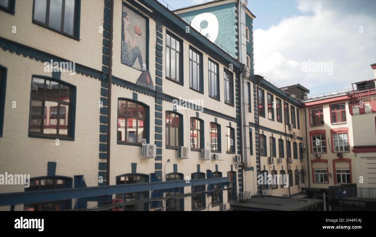 Facade of beautiful factory in city center. Action. Exterior ...