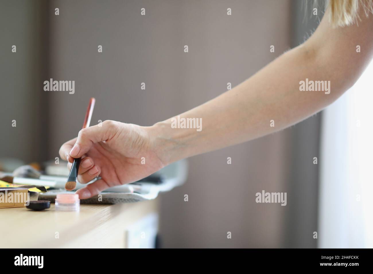 Adult holding natural tool Stock Photo - Alamy