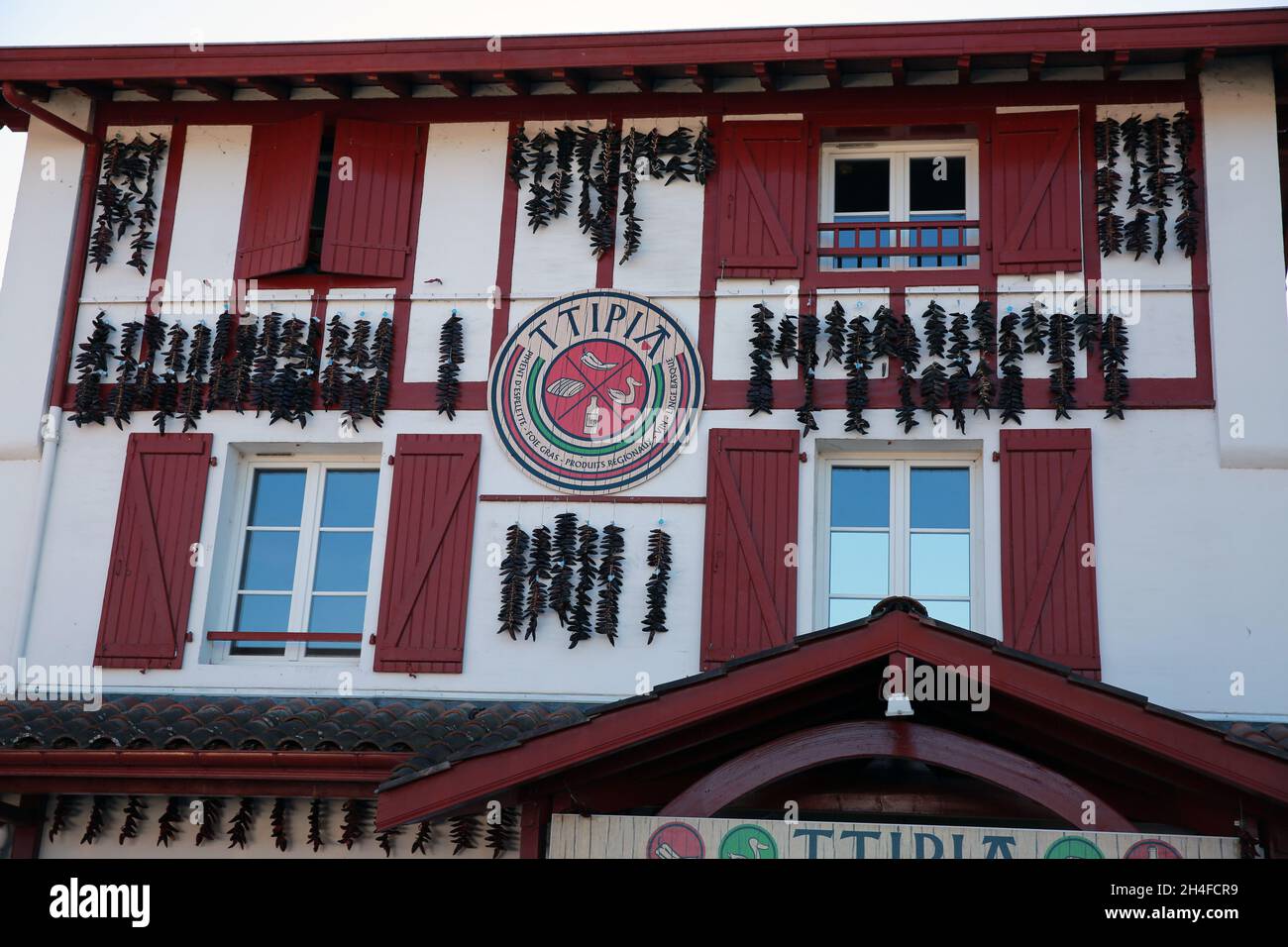 House covered in chillies in the famous village of Espelette, Pays ...