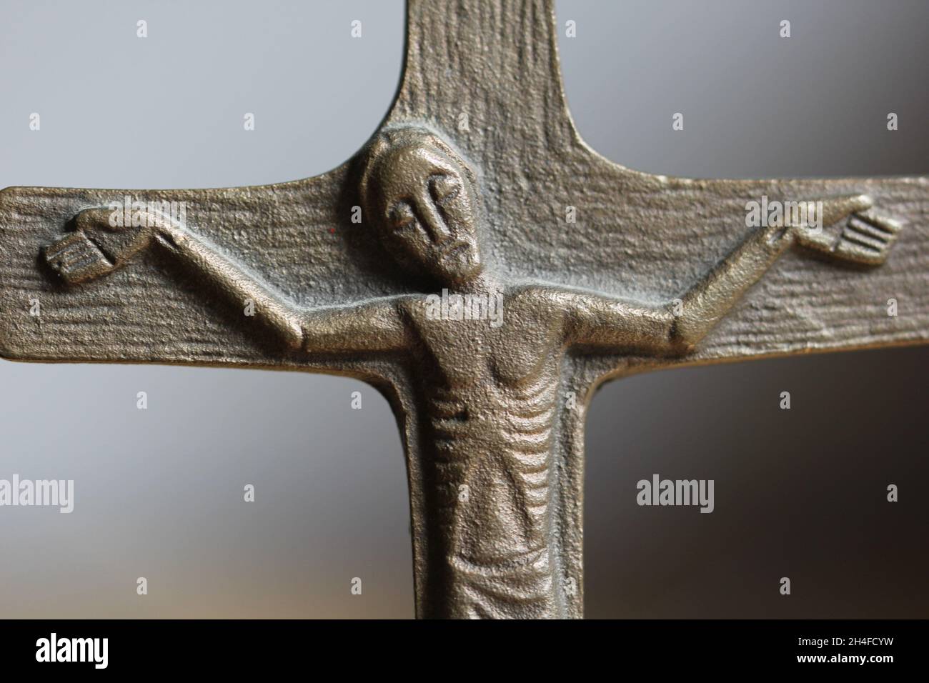 Selective focus shot of a bronze cross with crucified Jesus Christ Stock Photo - Alamy