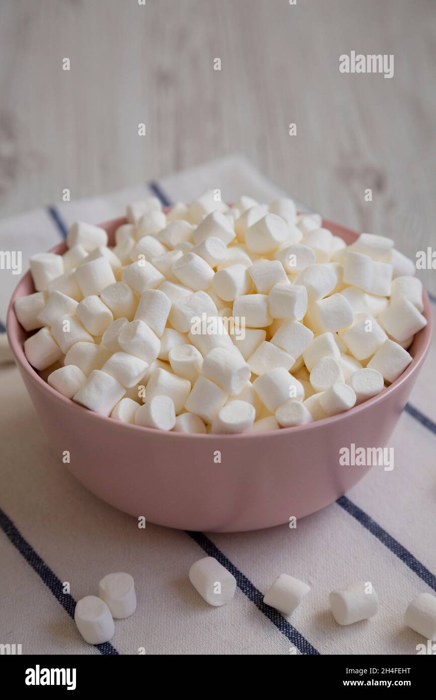 White Mini Marshmallows in a Pink Bowl, low angle view Stock Photo - Alamy