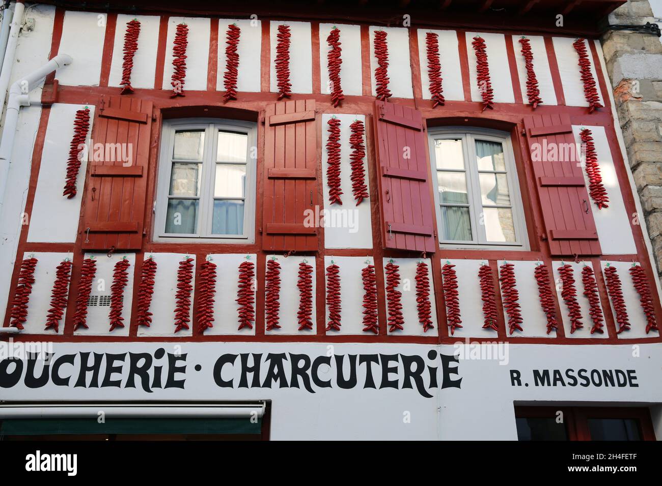 House covered in chillies in the famous village of Espelette, Pays ...
