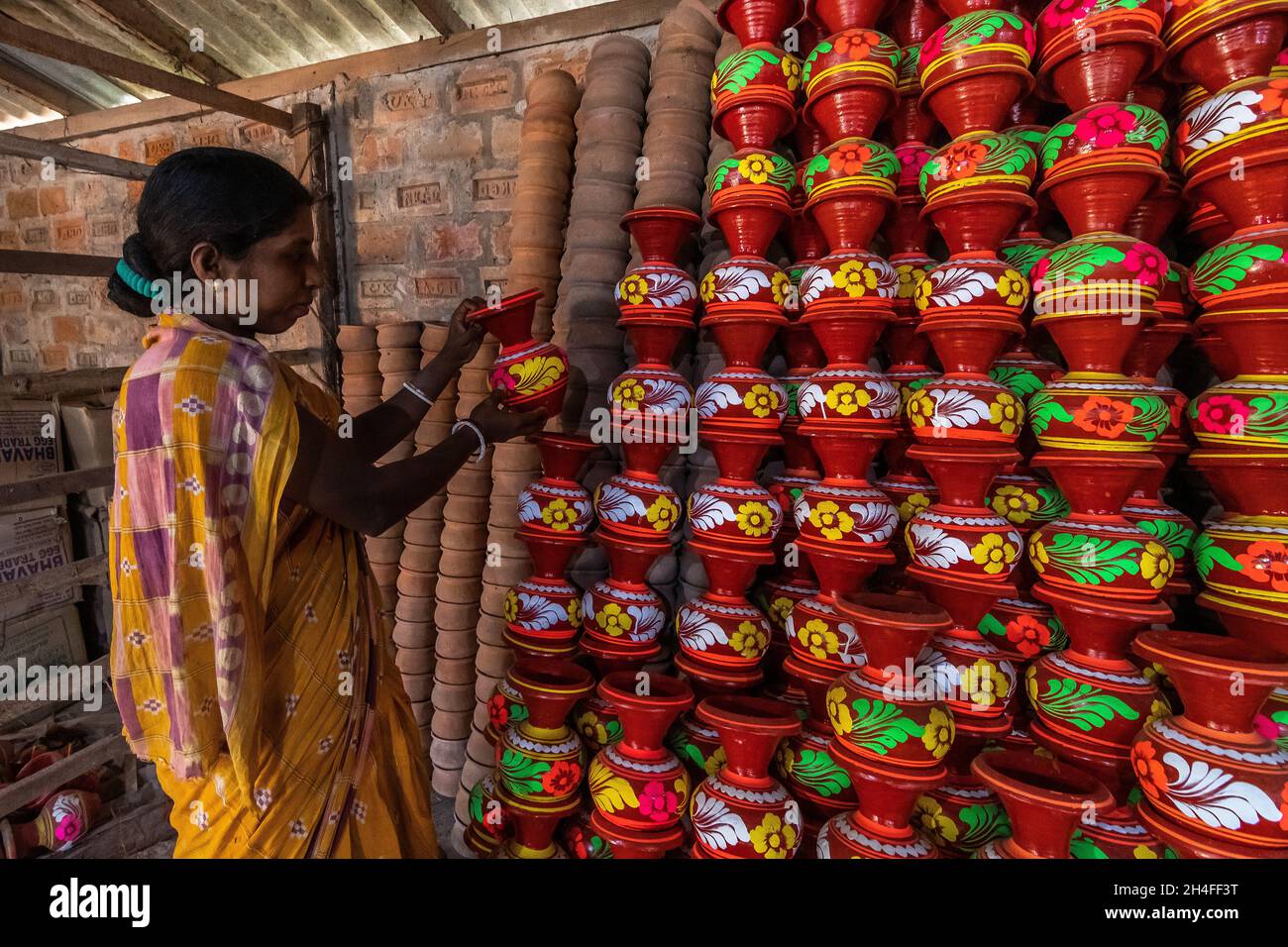 Kolkata, India. 02nd Nov, 2021. Potter is busy making Diya (lamp ...