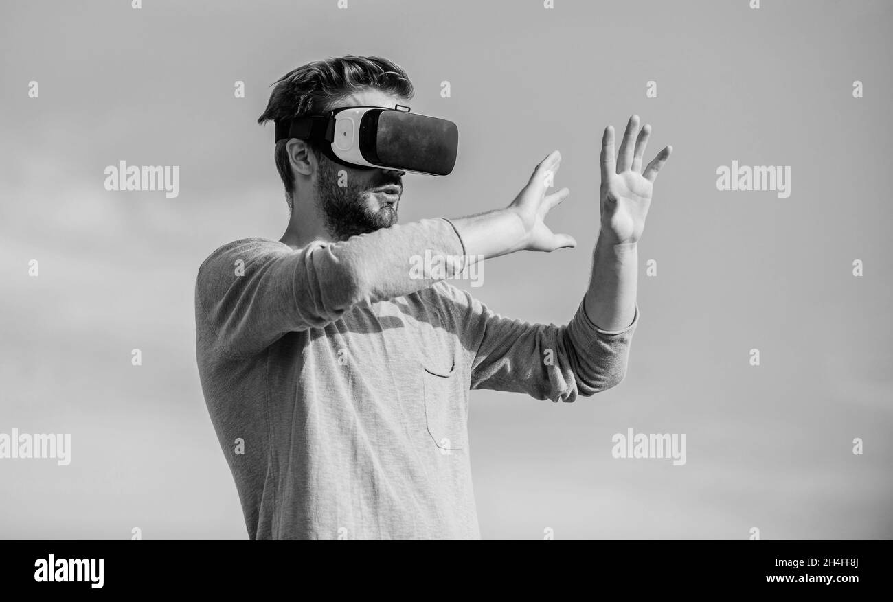 Virtual reality. Game online. Virtual reality goggles. Handsome man ...