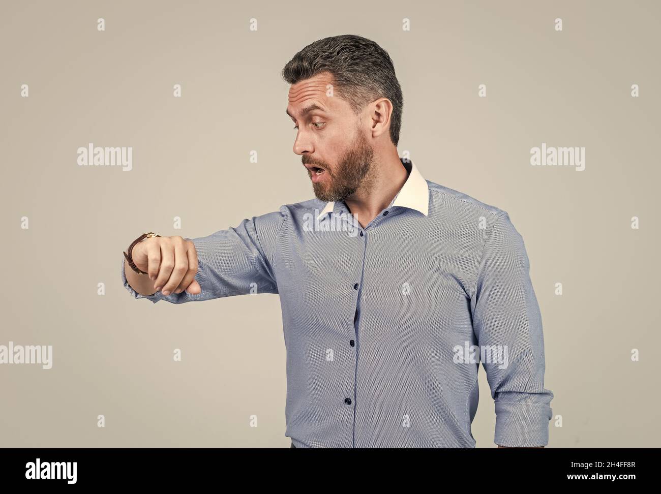 shocked businessman with hand watch. ceo man checking time. wristwatch ...