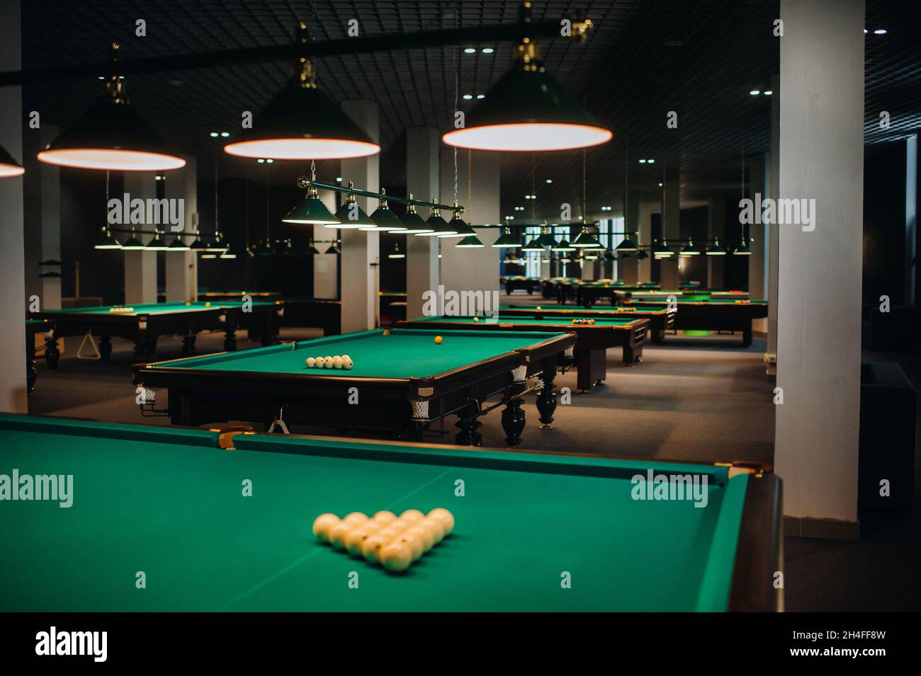 Billiard table with green surface and balls in the billiard club Stock ...