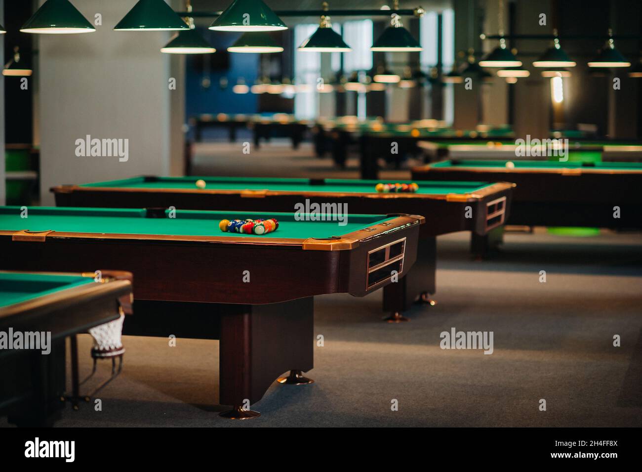 Billiard table with green surface and balls in the billiard club.Pool ...