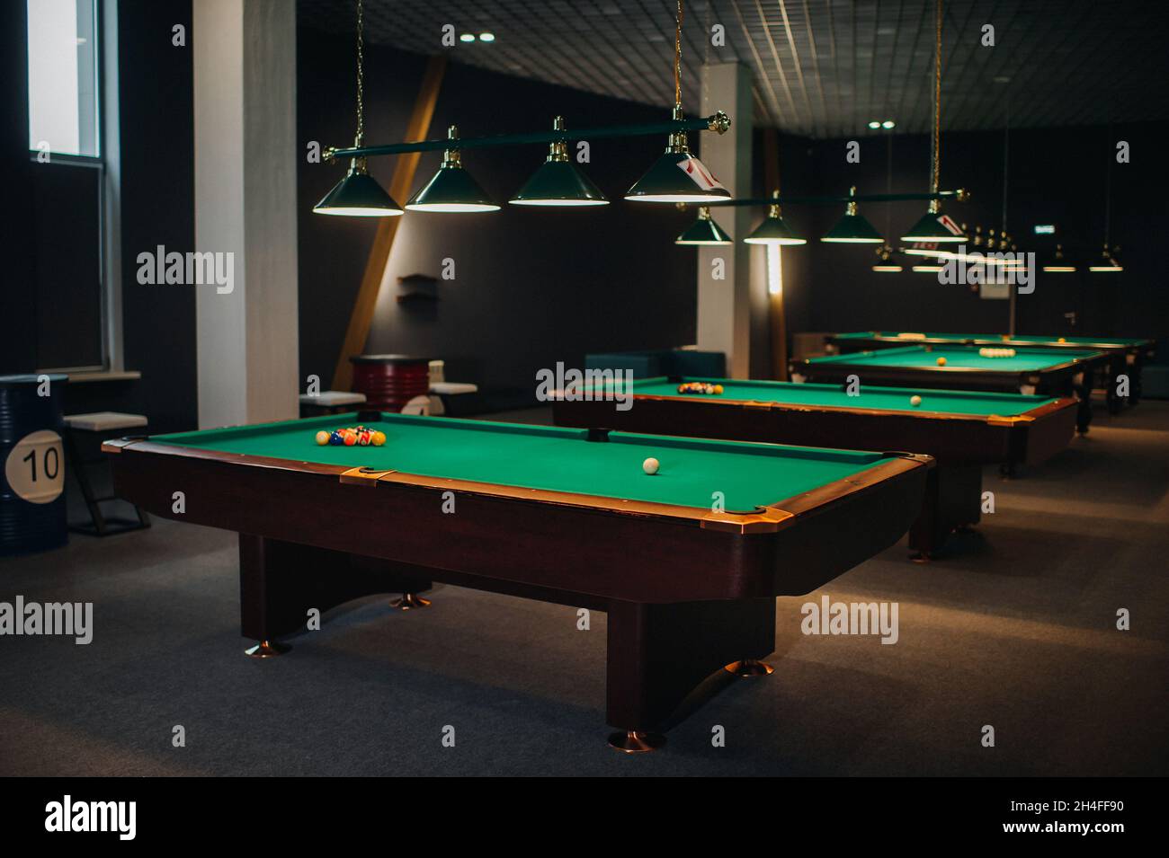 Billiard table with green surface and balls in the billiard club.Pool ...