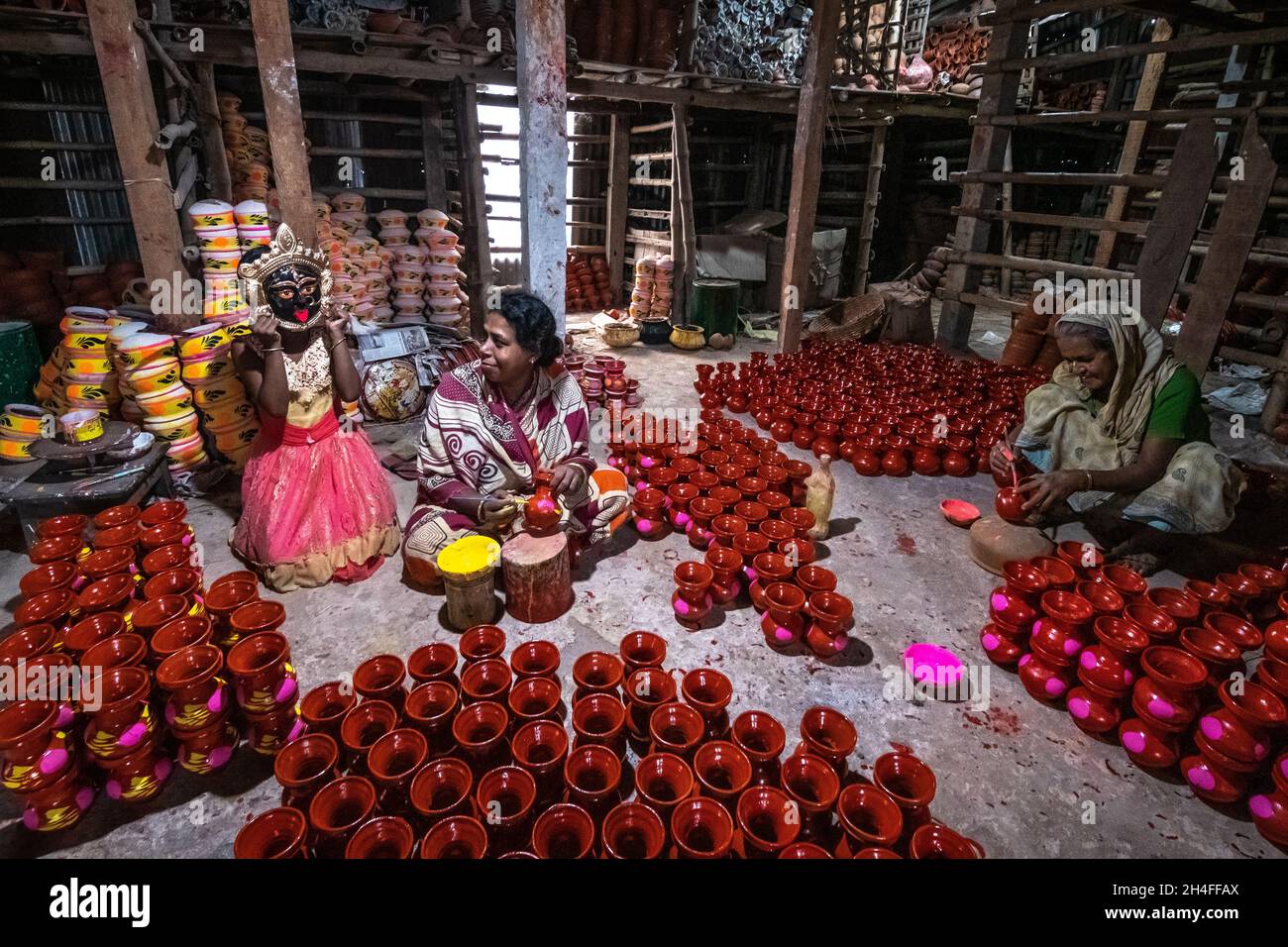 Kolkata, India. 02nd Nov, 2021. Potter is busy making Diya (lamp ...