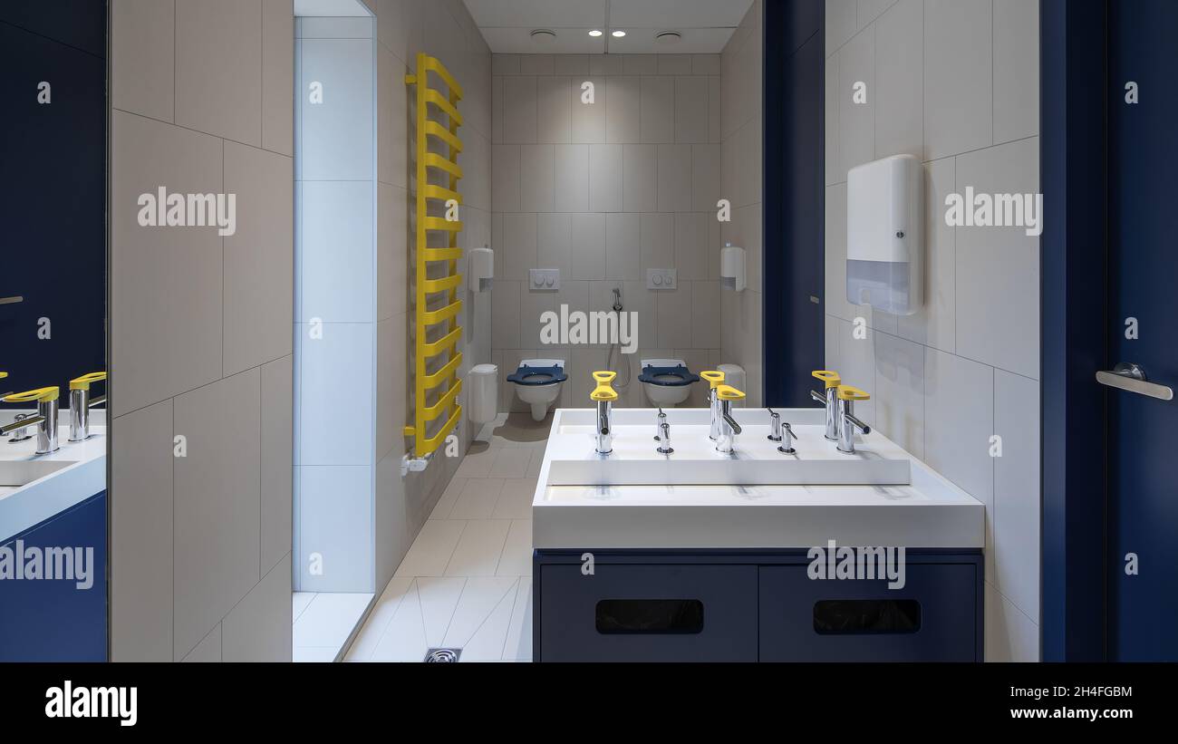 Modern public restroom for children minimal interior yellow and blue ...
