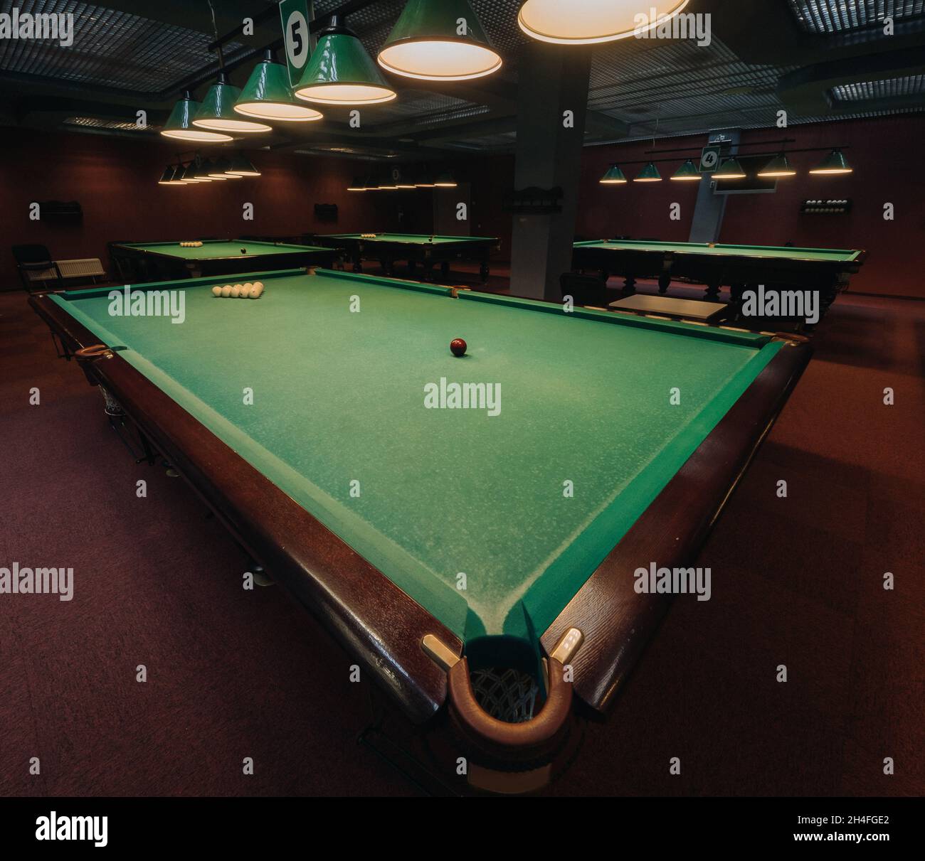 Billiard table with green surface and balls in the billiard club.Pool ...