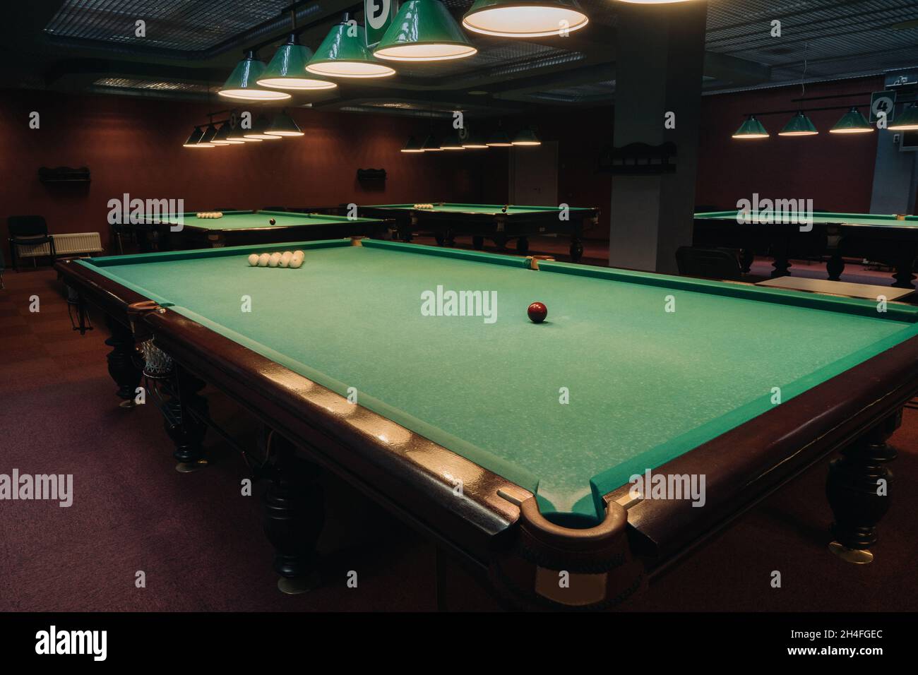 Billiard table with green surface and balls in the billiard club.Pool ...