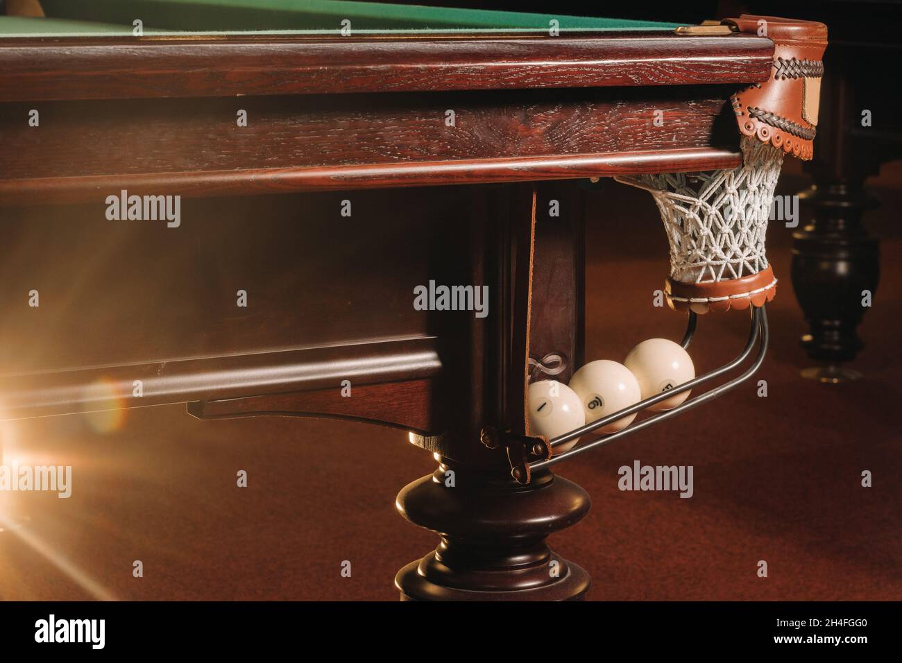 A pool table with balls that have already been played in the pool club ...