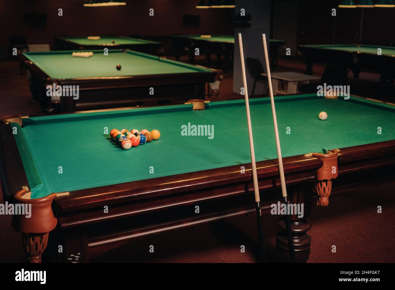 Billiard table with green surface and balls in the billiard club.Pool ...
