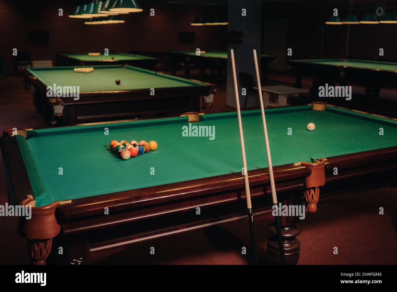 Billiard table with green surface and balls in the billiard club.Pool ...