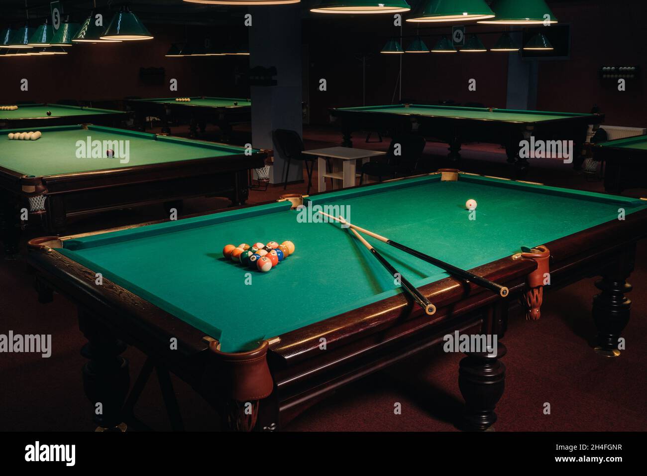 Billiard table with green surface and balls in the billiard club.Pool ...