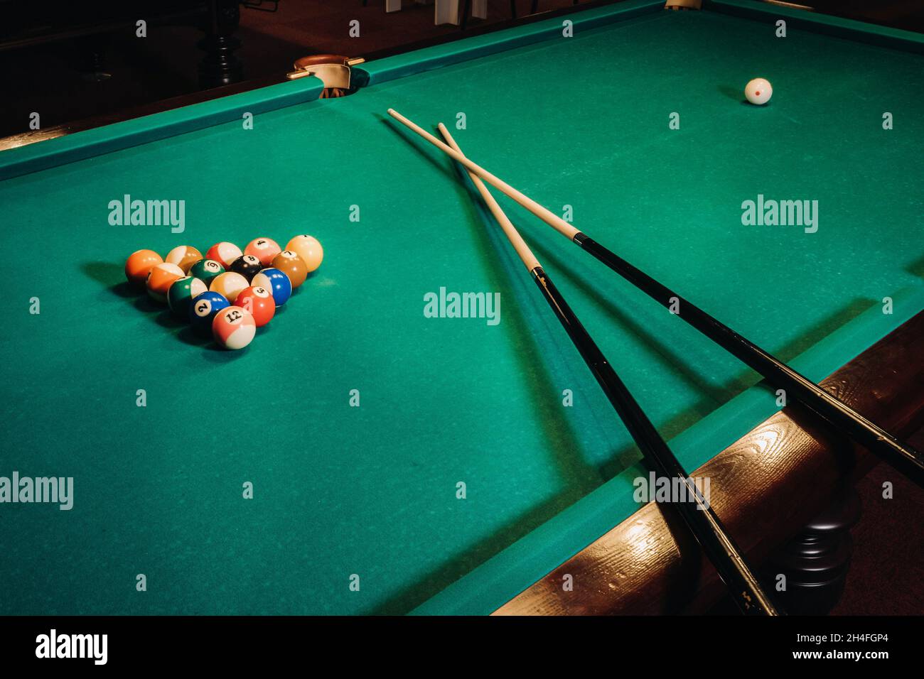 Billiard table with green surface and balls in the billiard club.Pool ...