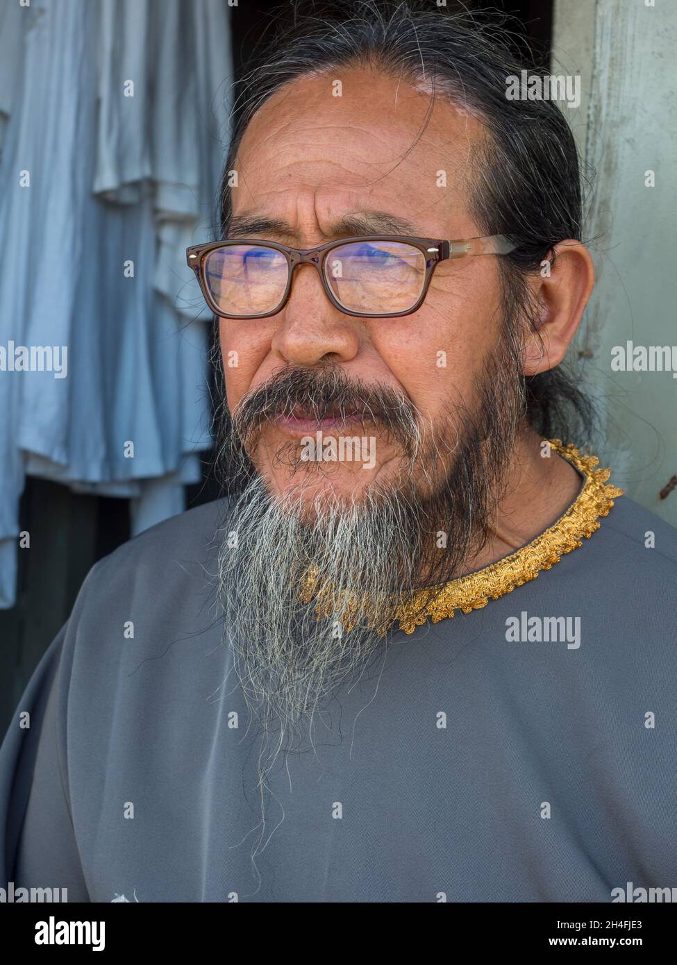 Pueblo, Peru - Mar 2018: Portrait of a preacher with a short gray beard ...