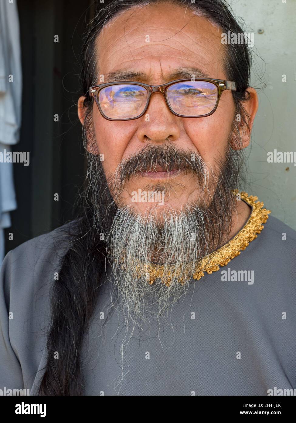 Pueblo, Peru - Mar 2018: Portrait of a preacher with a short gray beard ...