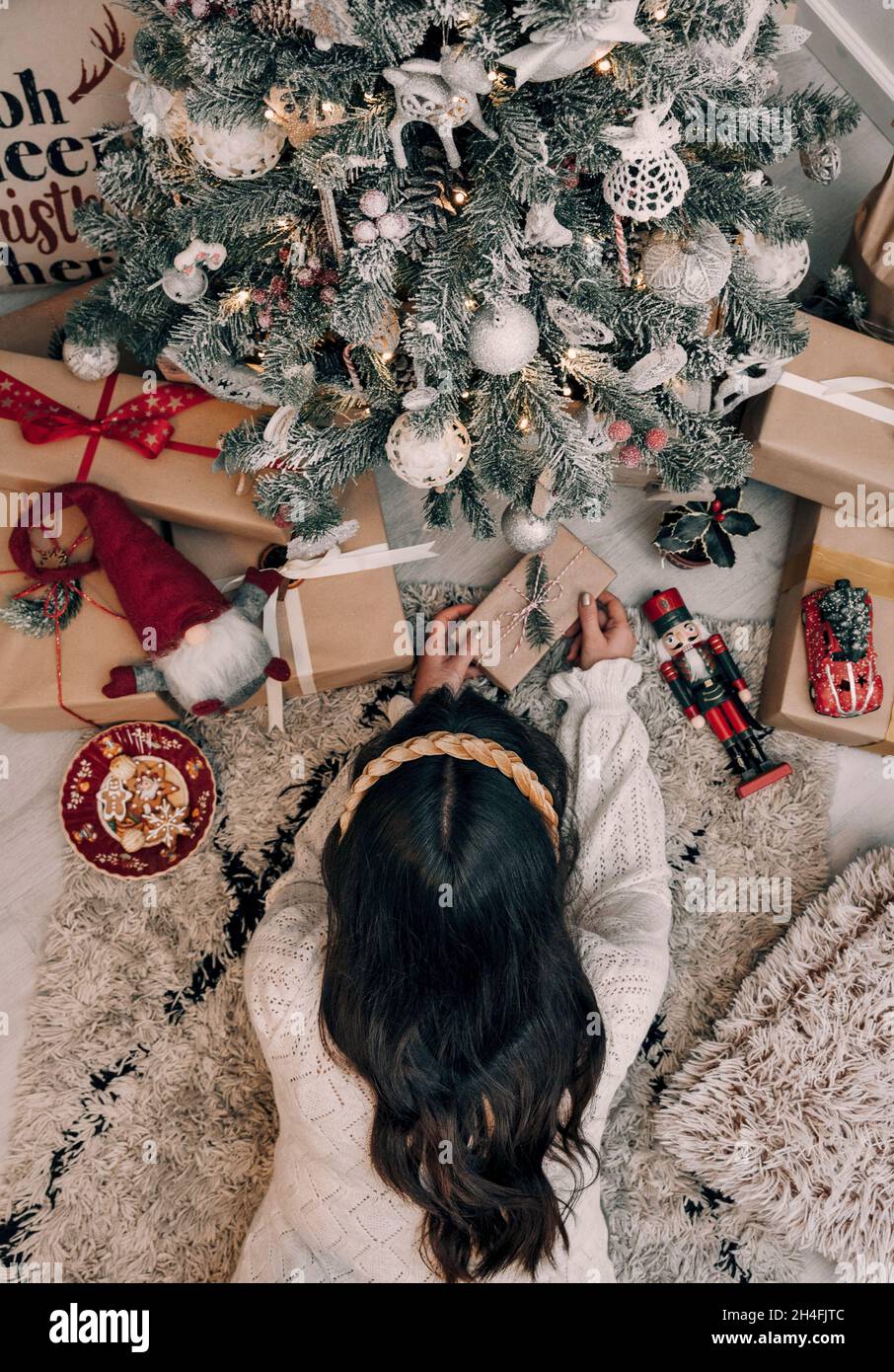 Person and christmas tree hi-res stock photography and images - Alamy