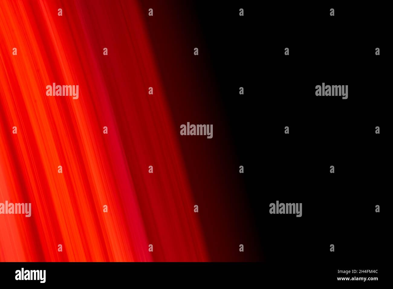 Abstraction. Red diagonal lines with a gradient occupying half of the ...