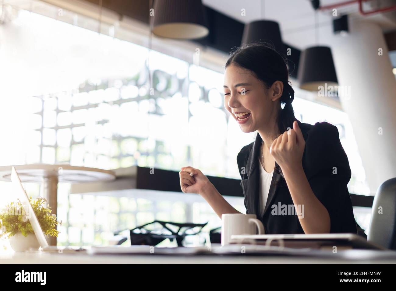 African woman laptop celebrating hi-res stock photography and images ...